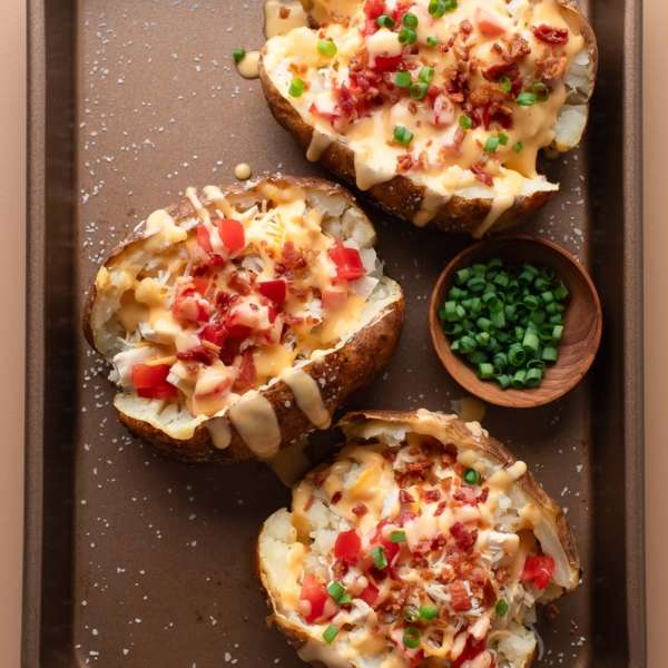 Cheesy Loaded Baked Potatoes with Chicken and Bacon