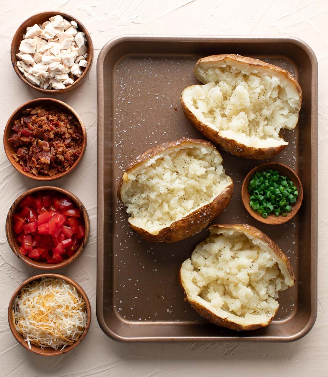 Cheesy Loaded Baked Potatoes with Chicken and Bacon